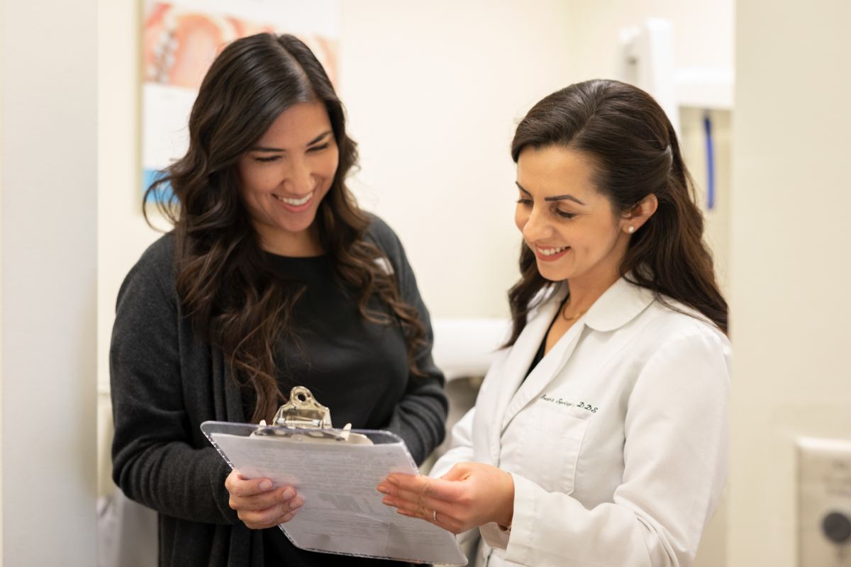 A Hispanic female PDS Health team member and a female Southern Asian ...